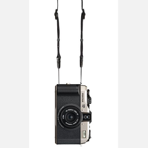Compact film camera with fixed focal length, designed to capture half ...