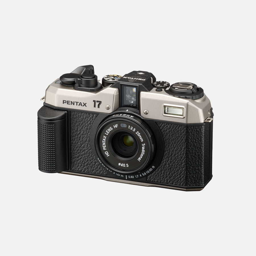 Compact film camera with fixed focal length, designed to capture half ...