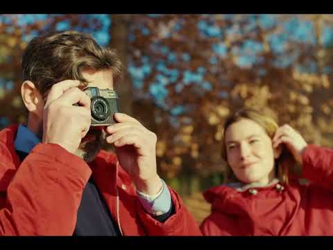 Compact film camera with fixed focal length, designed to capture half ...