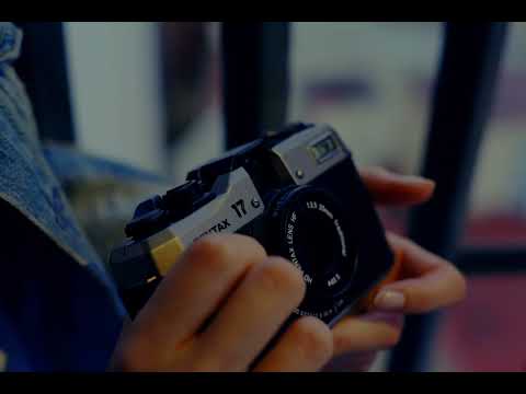 Compact film camera with fixed focal length, designed to capture half ...