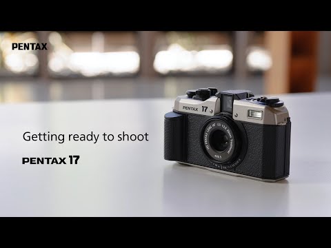 Compact film camera with fixed focal length, designed to capture half ...